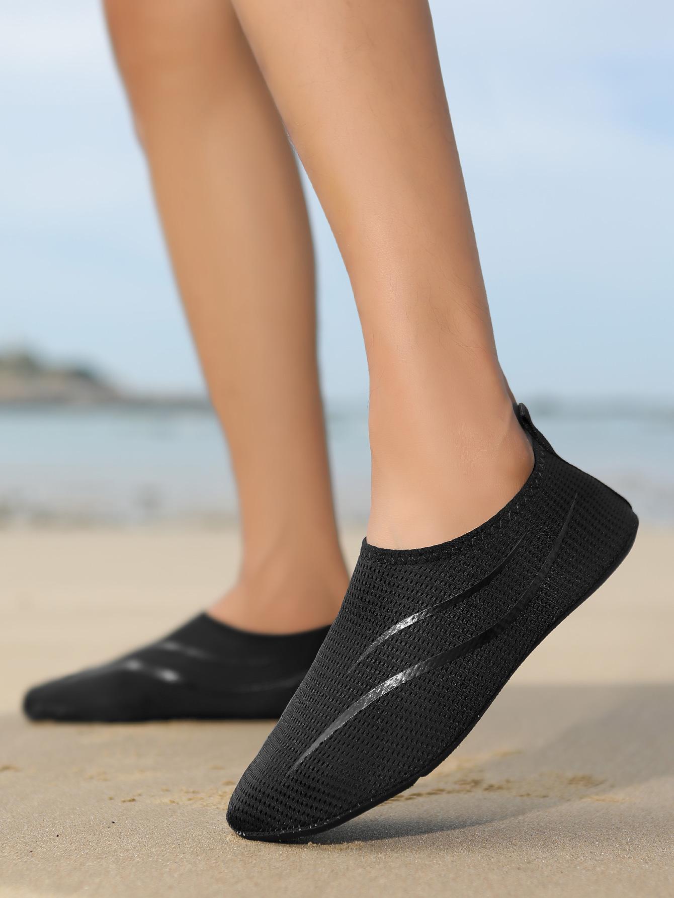 A pair of women's outdoor wading canyoning shoes, breathable and quick ...